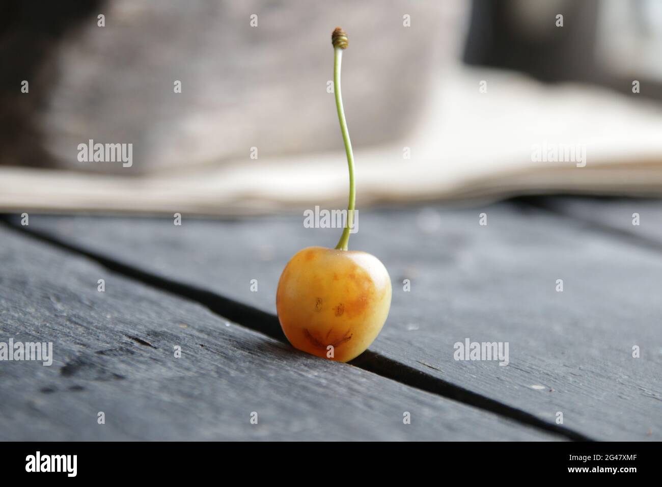 Smile concept. One cherry with a smile pattern on it Stock Photo - Alamy