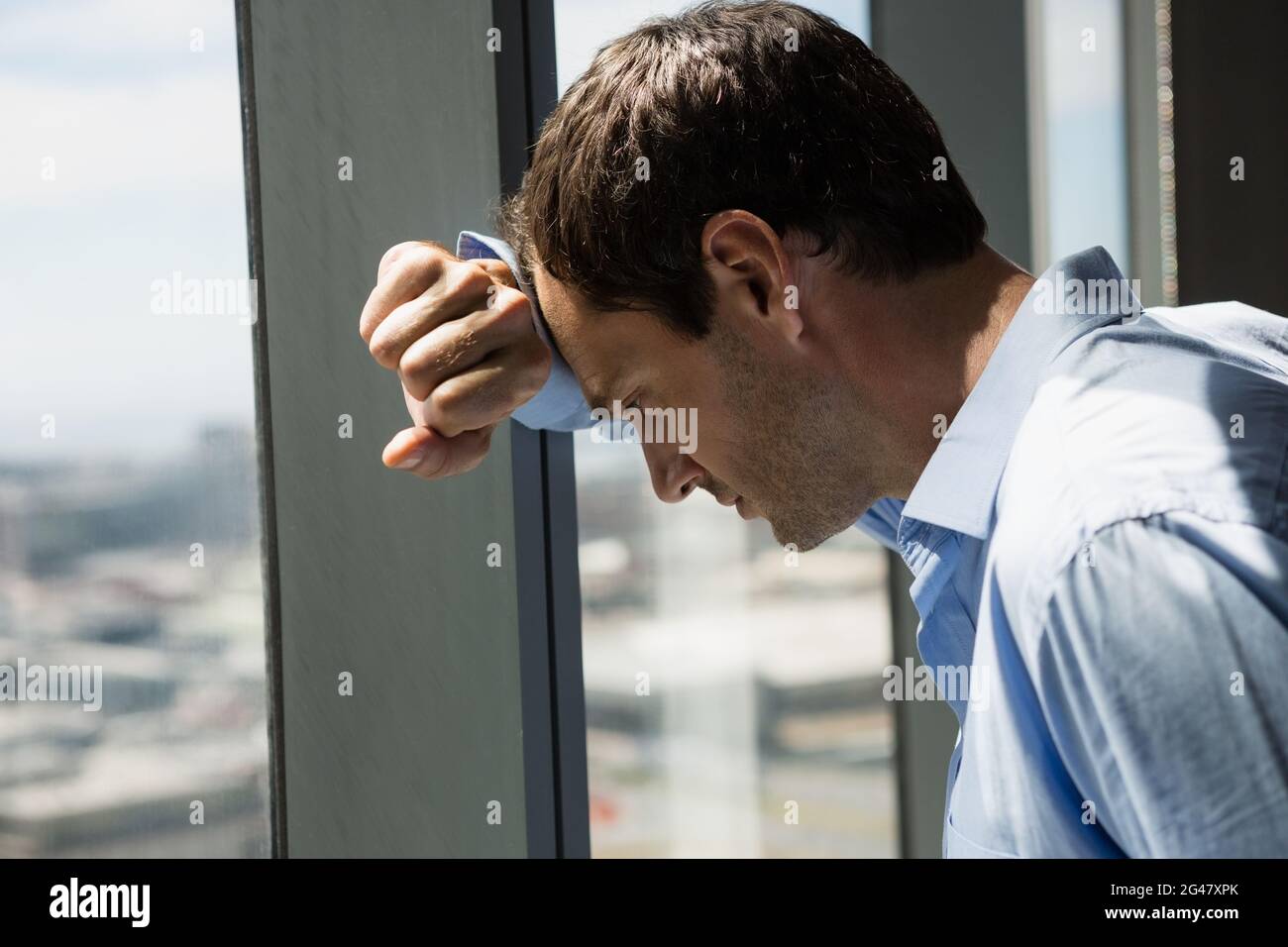 Worried male executive standing hi-res stock photography and images - Alamy