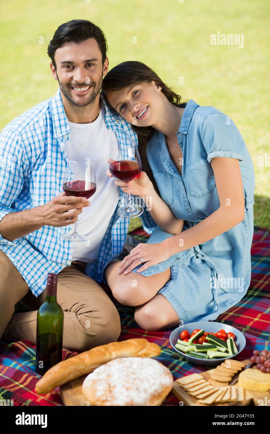 High angle portrait of smiling couple holding wineglasses Stock Photo ...