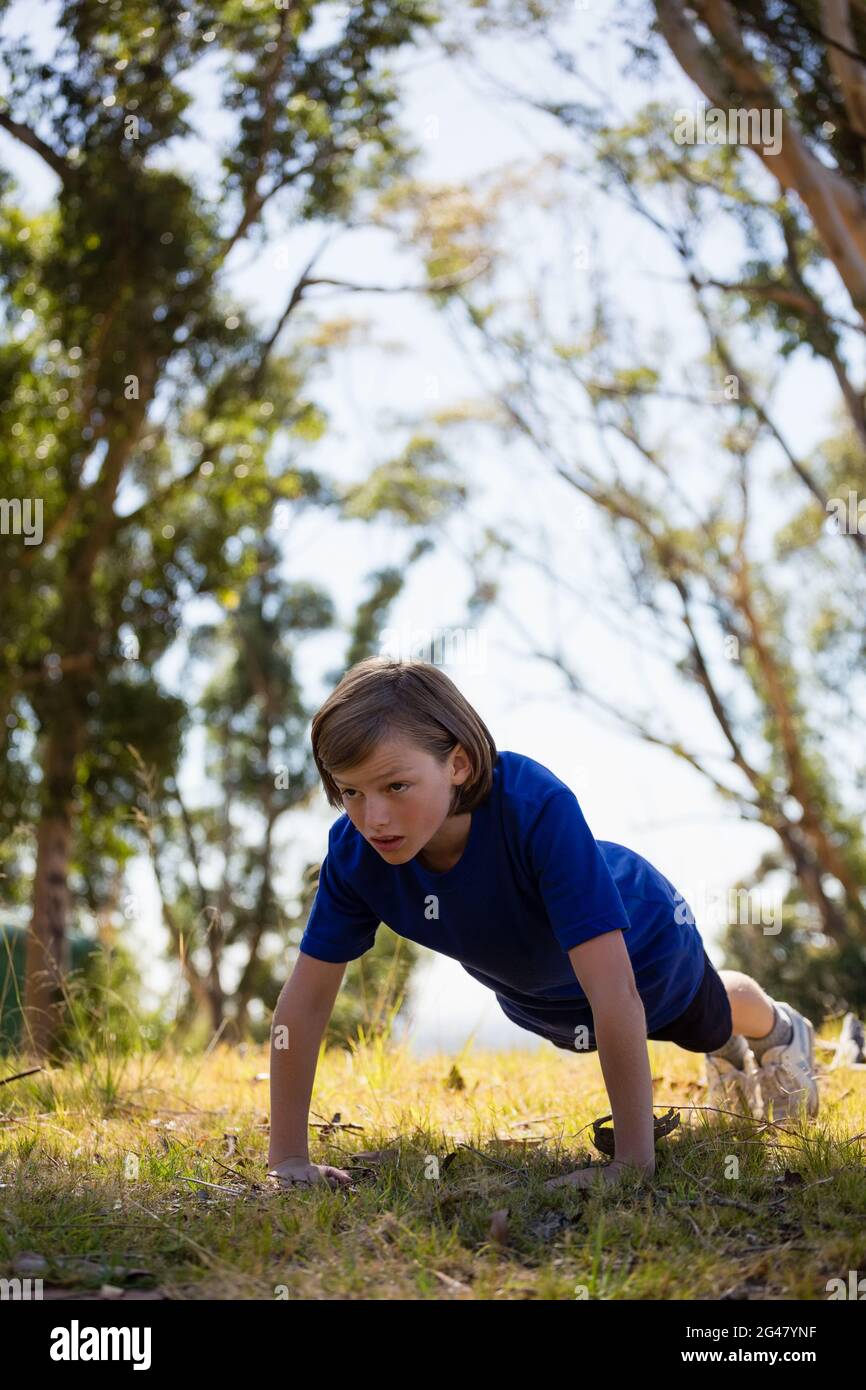 Girl exercising during obstacle course training Stock Photo - Alamy