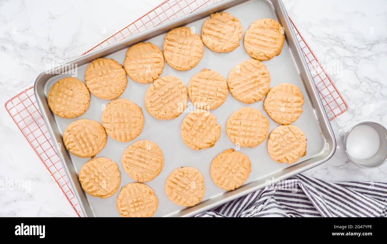 Flat lay. Step by step. Freshly baked peanut butter cookies on baking ...