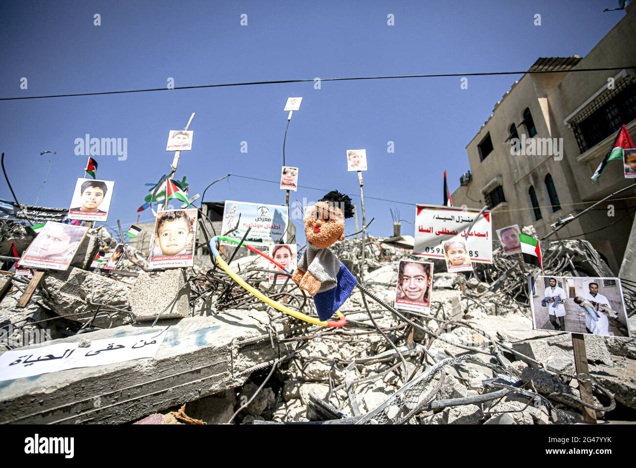 Gaza, Palestine. 19th June, 2021. A doll seen above pictures of the ...