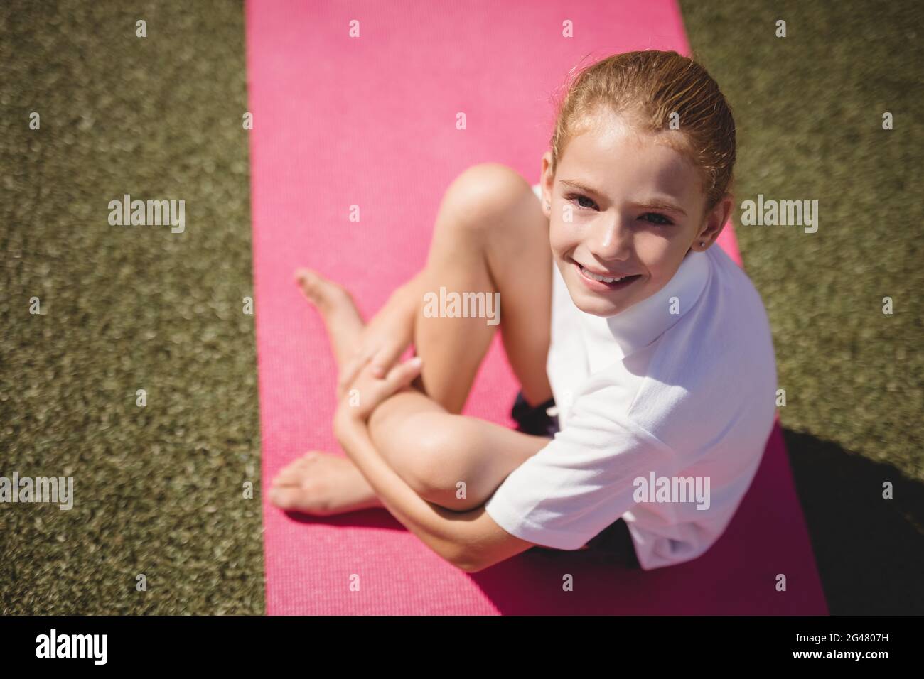 Girl sitting on exercising mat hi-res stock photography and images - Alamy