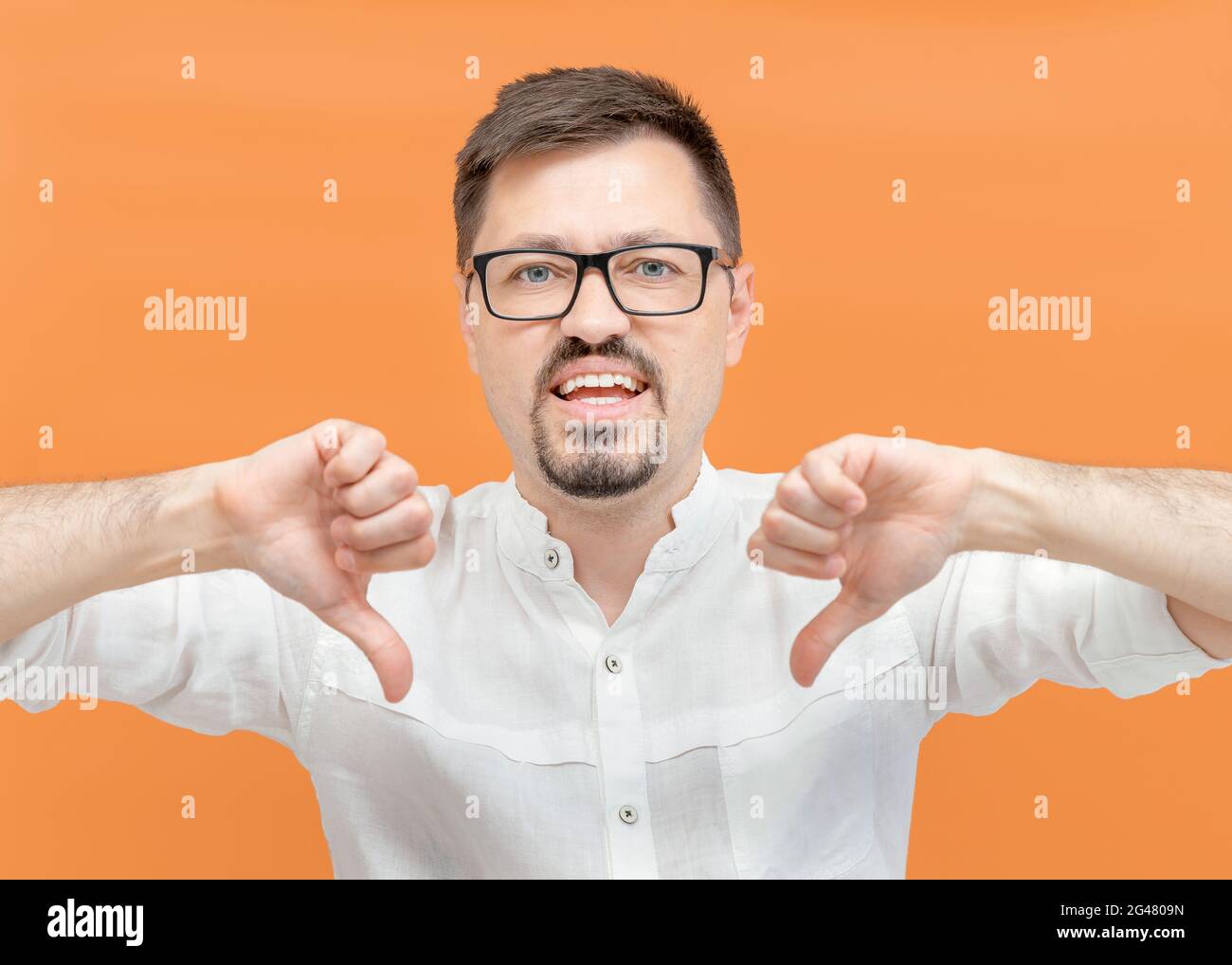 Angry man thumb down hi-res stock photography and images - Alamy