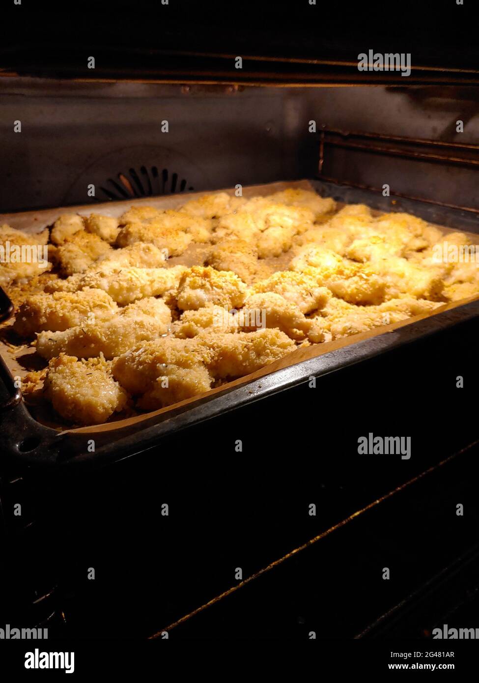 Homemade delicious crispy dish in a casserole in the oven Stock Photo ...