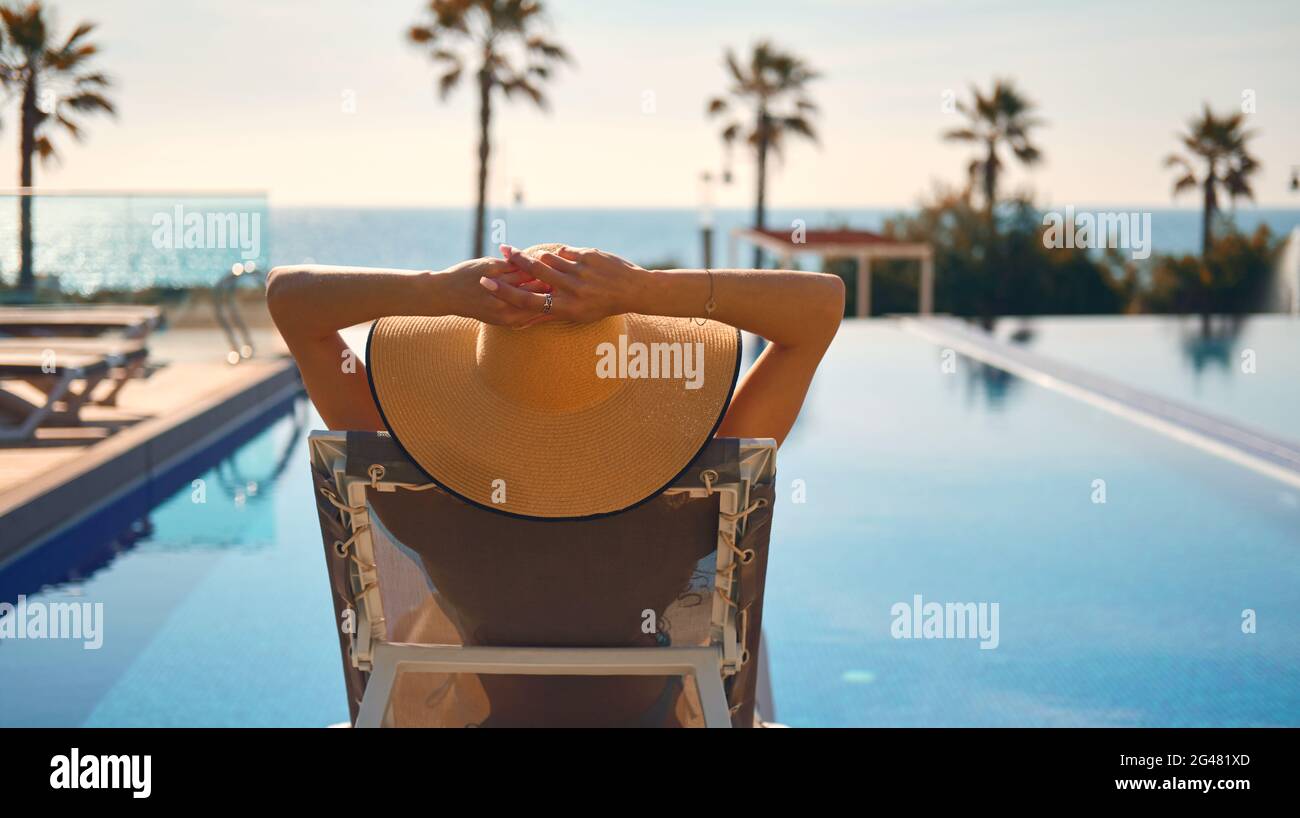 Girl lying on sunbed sea hi-res stock photography and images - Alamy
