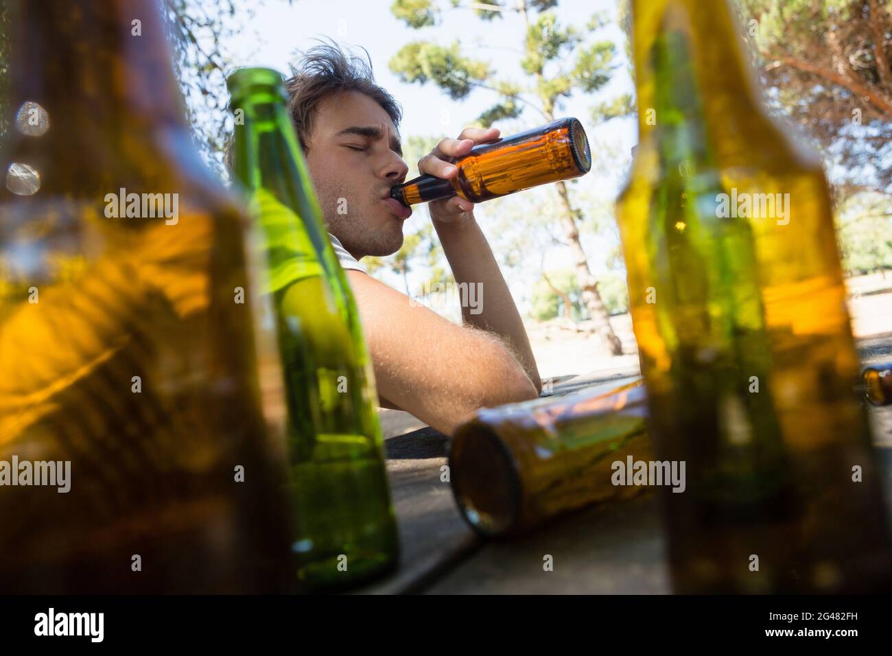 Man drinking beer from bottle hi-res stock photography and images - Alamy