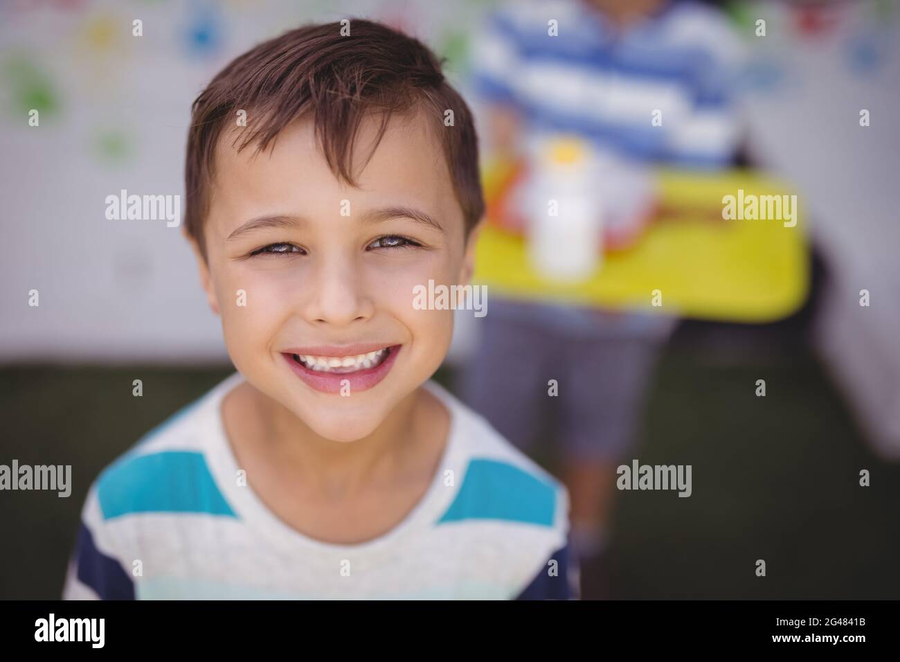 Portrait of happy schoolboy Stock Photo - Alamy