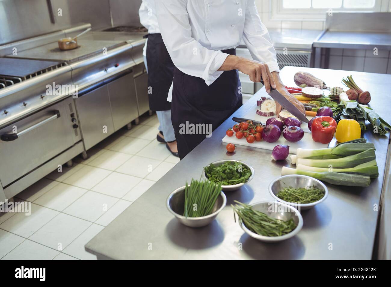 Chef chopping cherry tomato hi-res stock photography and images - Alamy
