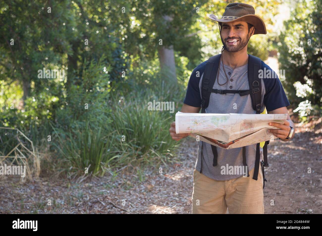 Smiling young indian hiker hi-res stock photography and images - Alamy