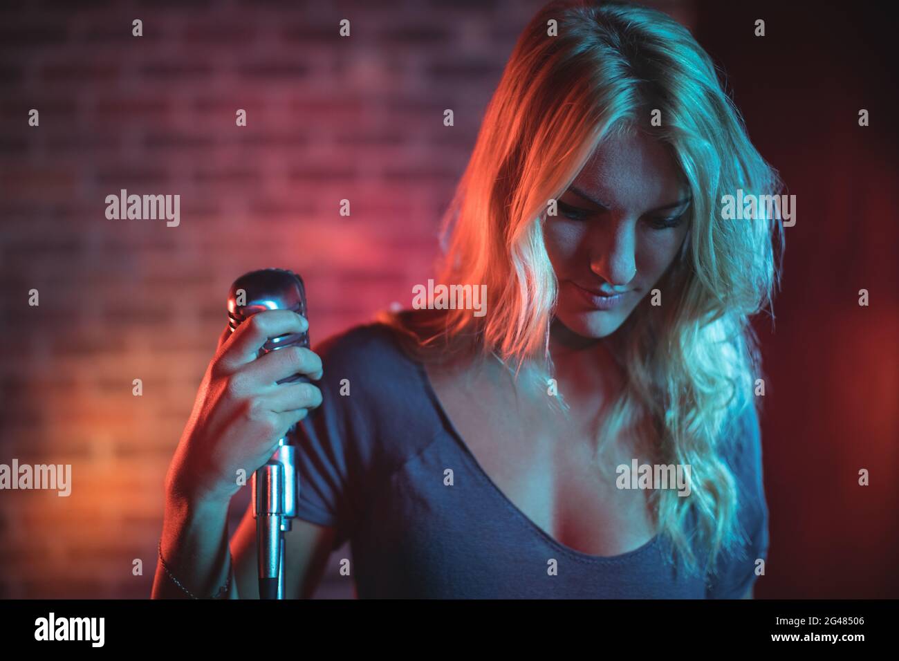 Female singer performing in nightclub Stock Photo - Alamy