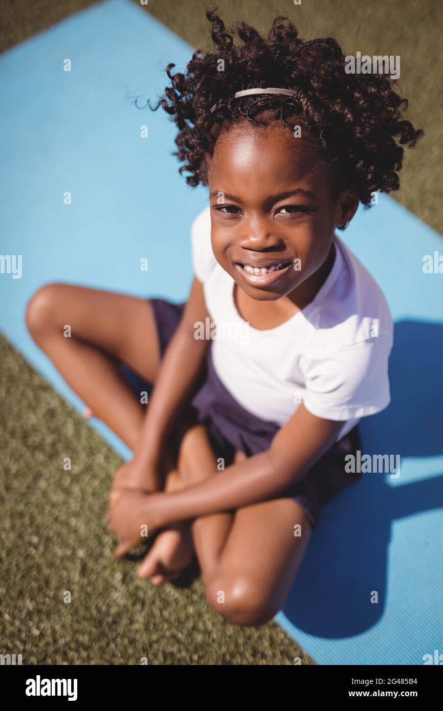 Girl sitting on exercising mat hi-res stock photography and images - Alamy