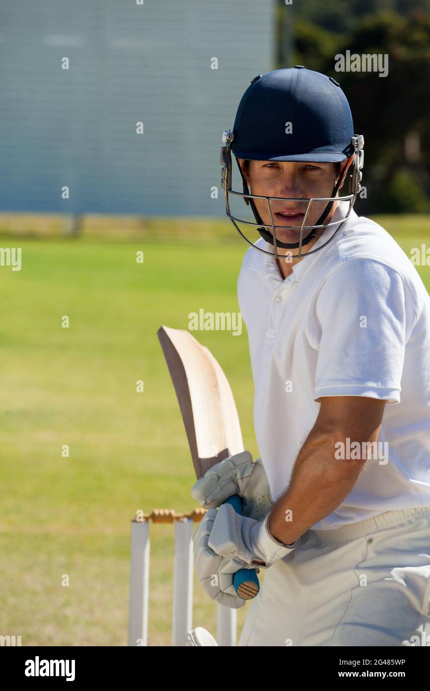 Player playing cricket on field Stock Photo - Alamy