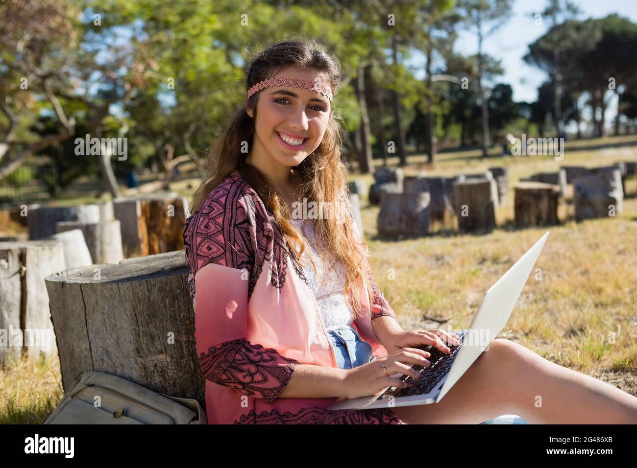 Holding laptop bag park hi-res stock photography and images - Alamy