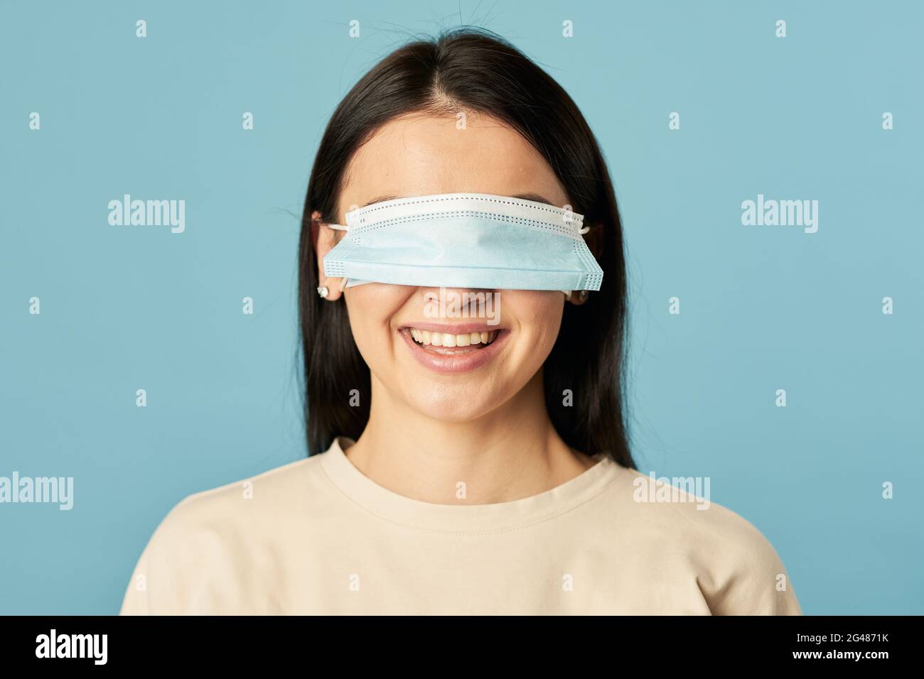 Blue mask smiling face hi-res stock photography and images - Alamy