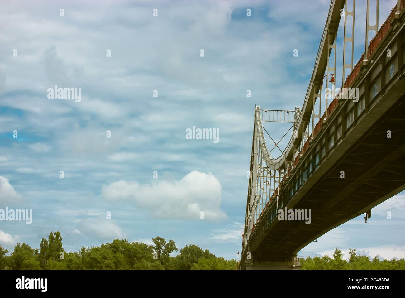 A modern pedestrian iron cable-stayed bridge with supporting structure ...