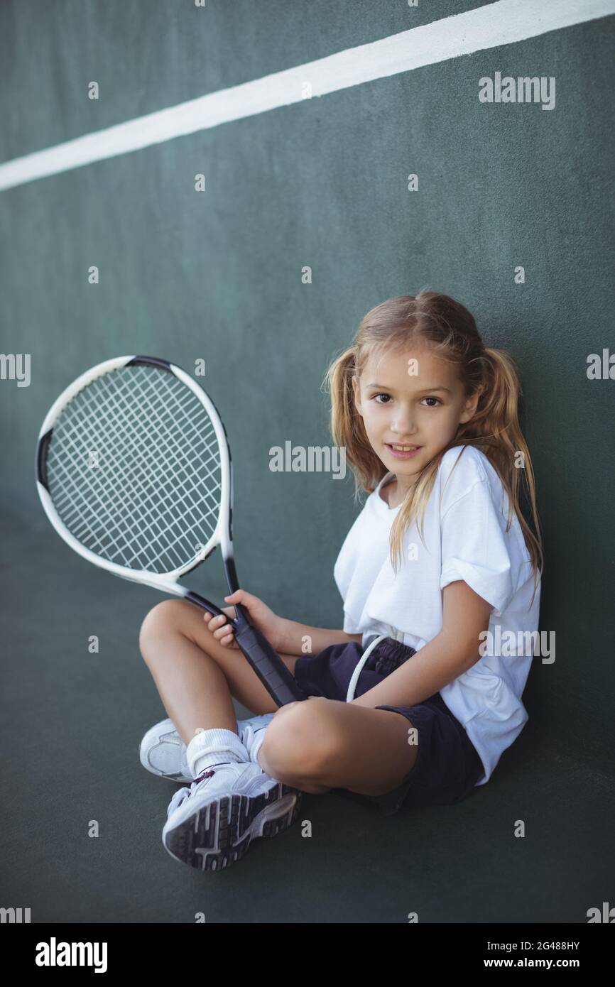 Portrait of girl holding tennis racket Stock Photo - Alamy