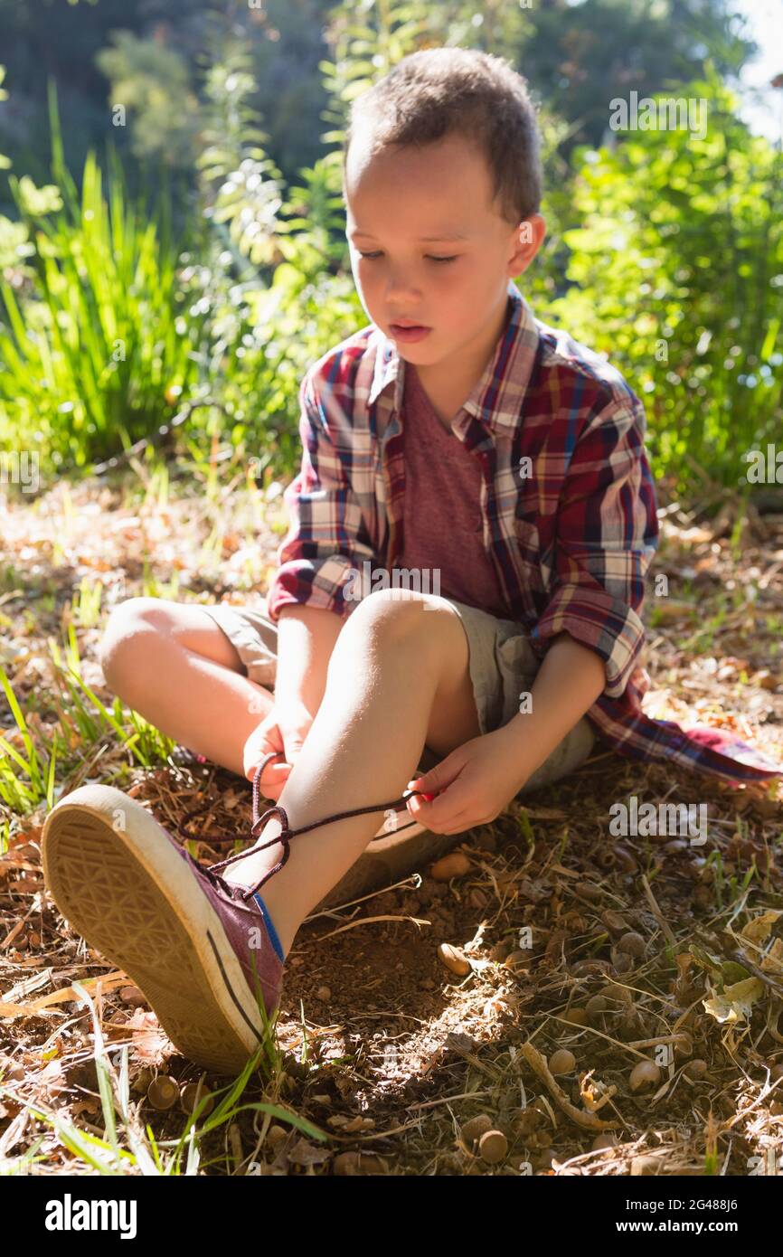 Boy tying shoe hi-res stock photography and images - Alamy