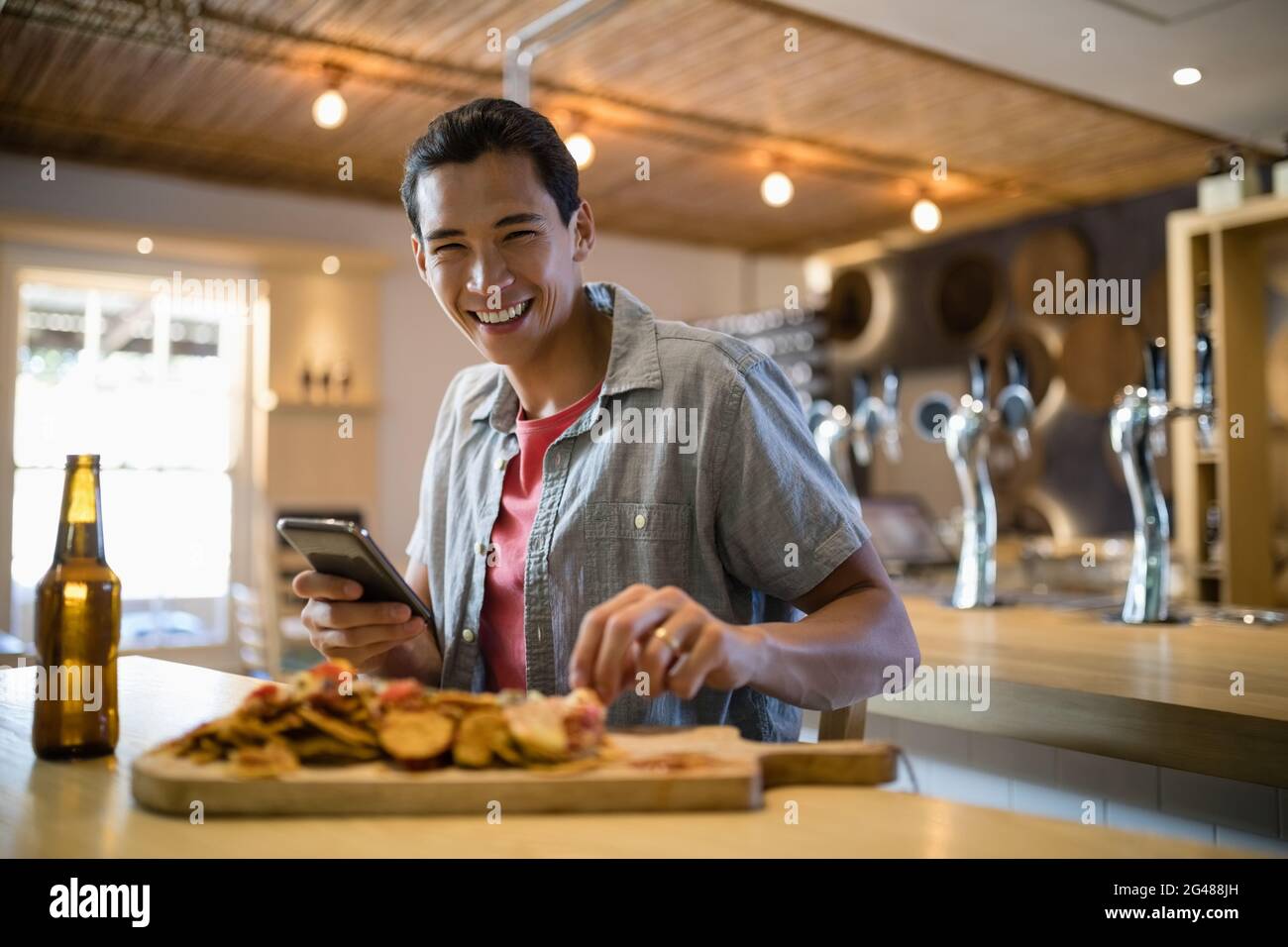 Man eating food in a restaurant Stock Photo - Alamy