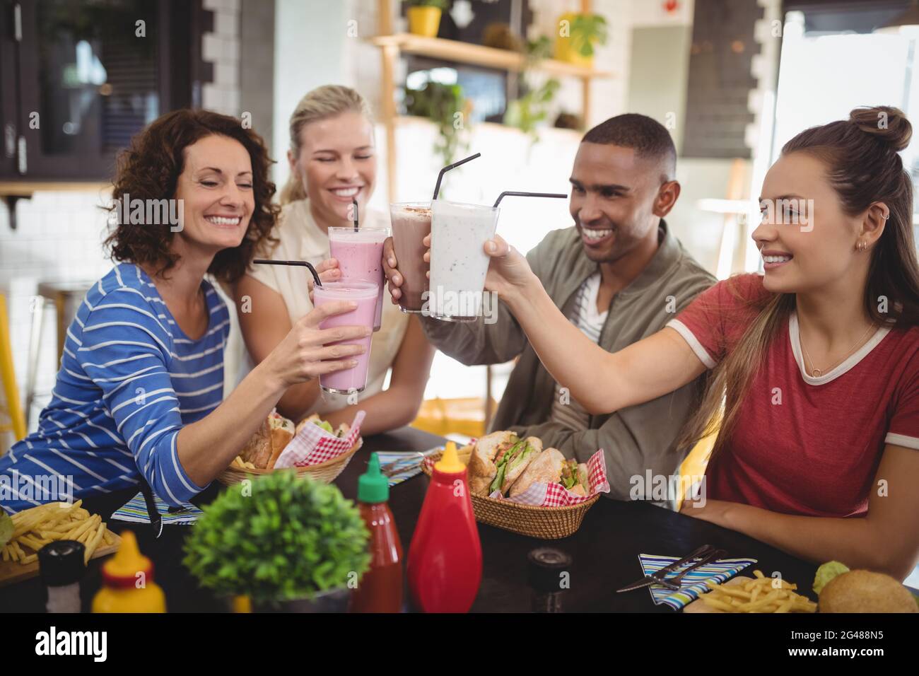 Young happy man raising toast hi-res stock photography and images - Alamy