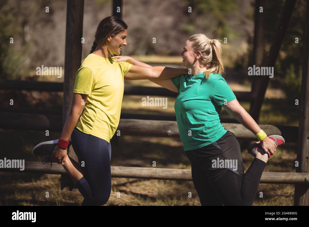Happy women exercising during obstacle course Stock Photo - Alamy