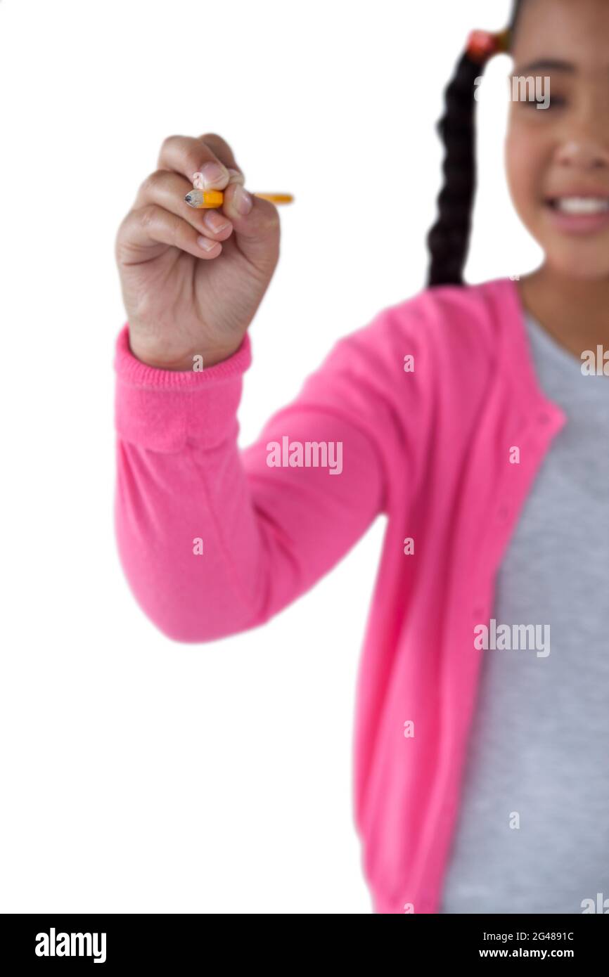 Girl pretending to write on invisible screen Stock Photo - Alamy