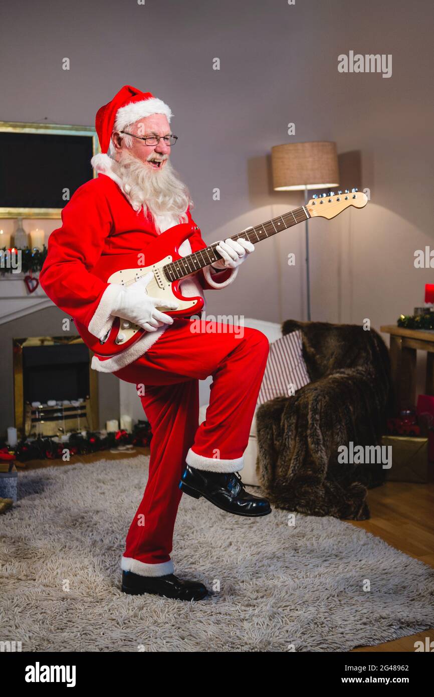 Guitar playing santa claus hi-res stock photography and images - Alamy