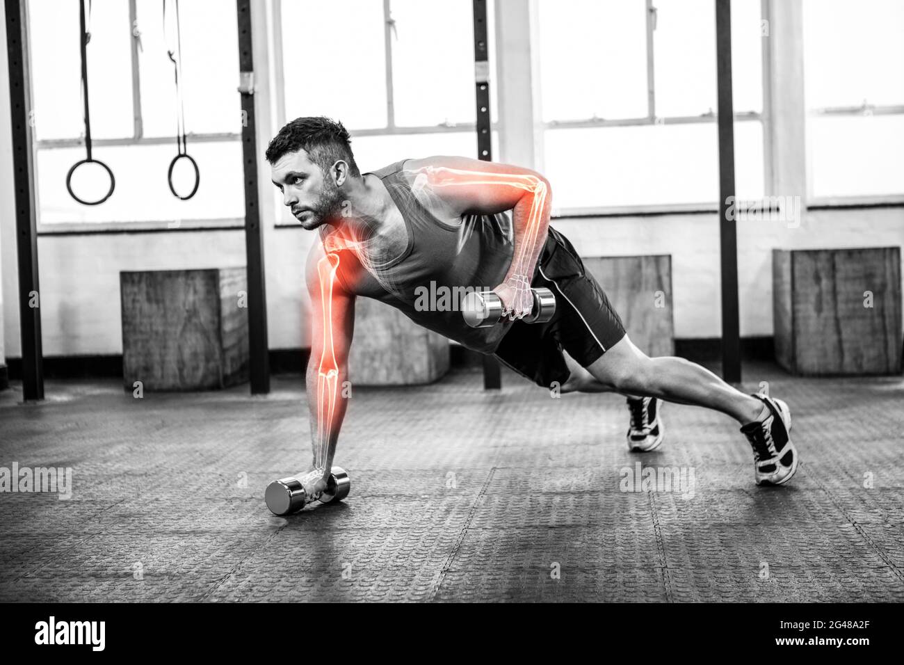Highlighted body of strong man lifting weights at gym Stock Photo - Alamy