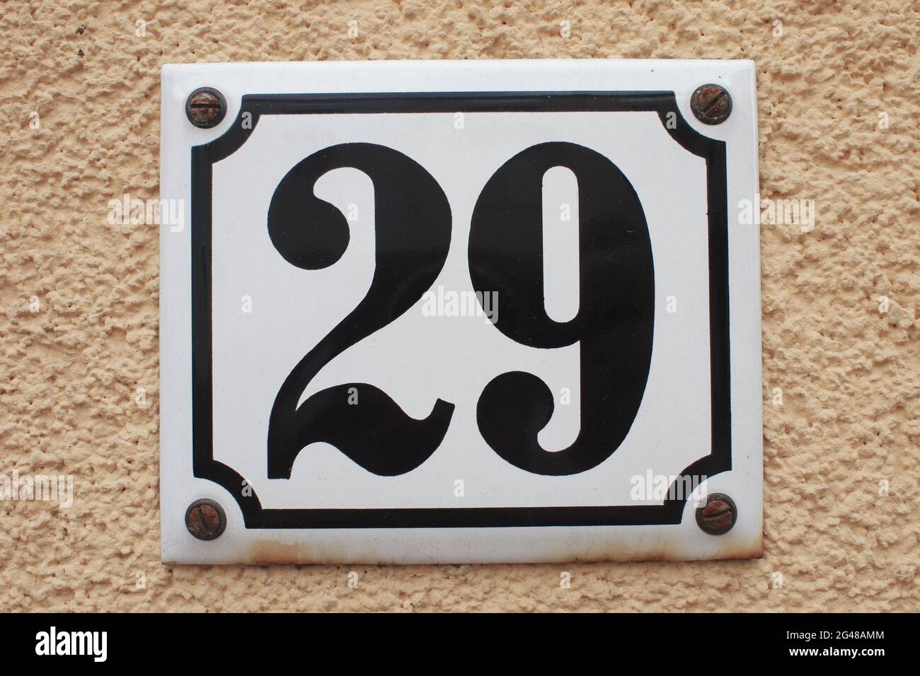 House number "29" attached to a wall Stock Photo - Alamy