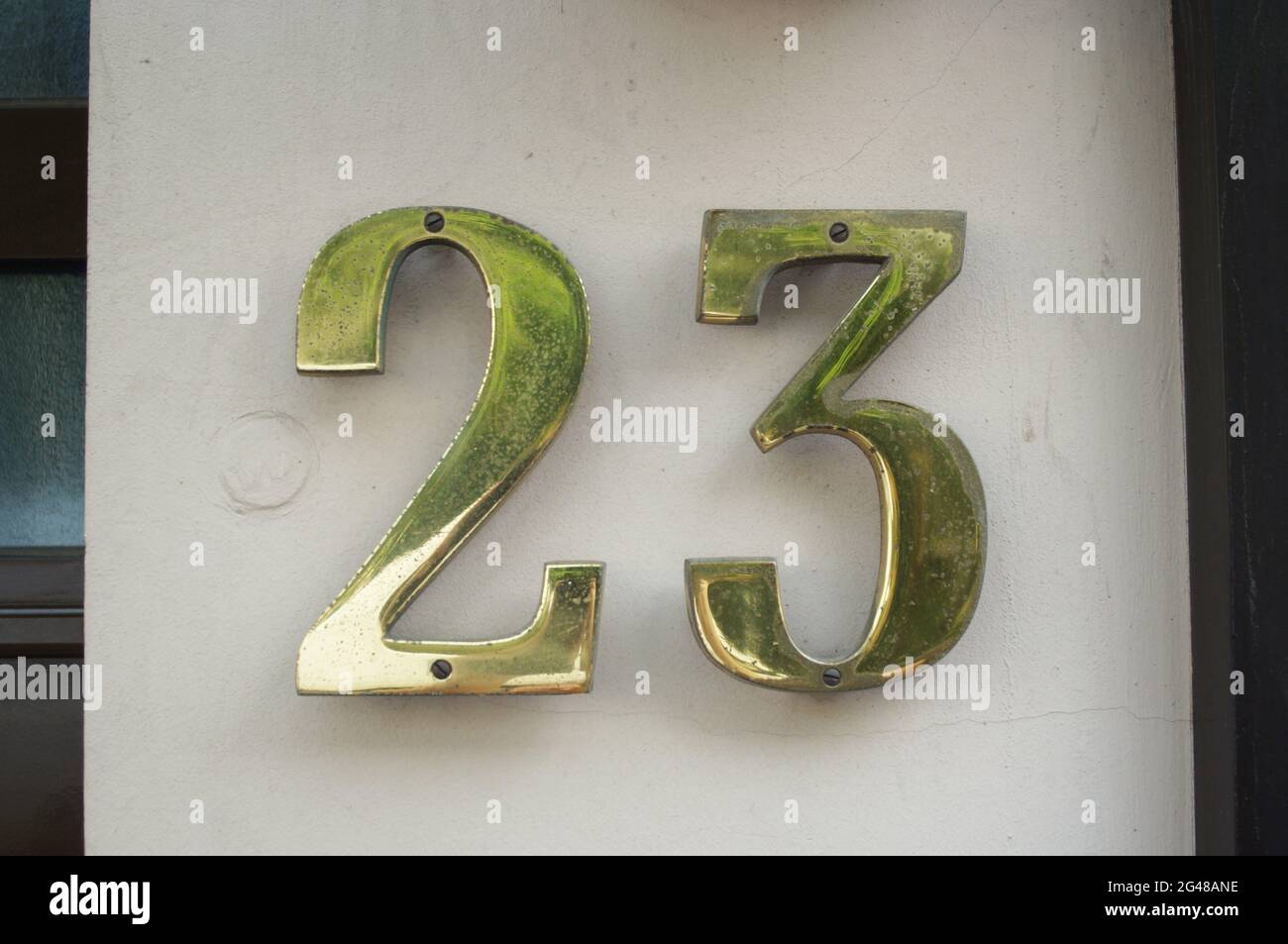 House number "23" attached to a wall Stock Photo - Alamy