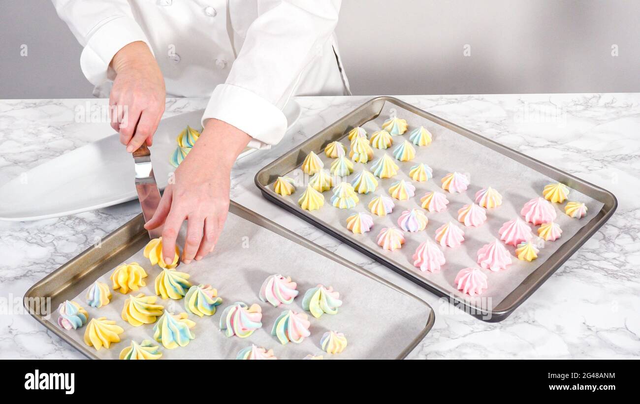 Step by step. Freshly baked unicorn meringue cookies on a baking sheet ...