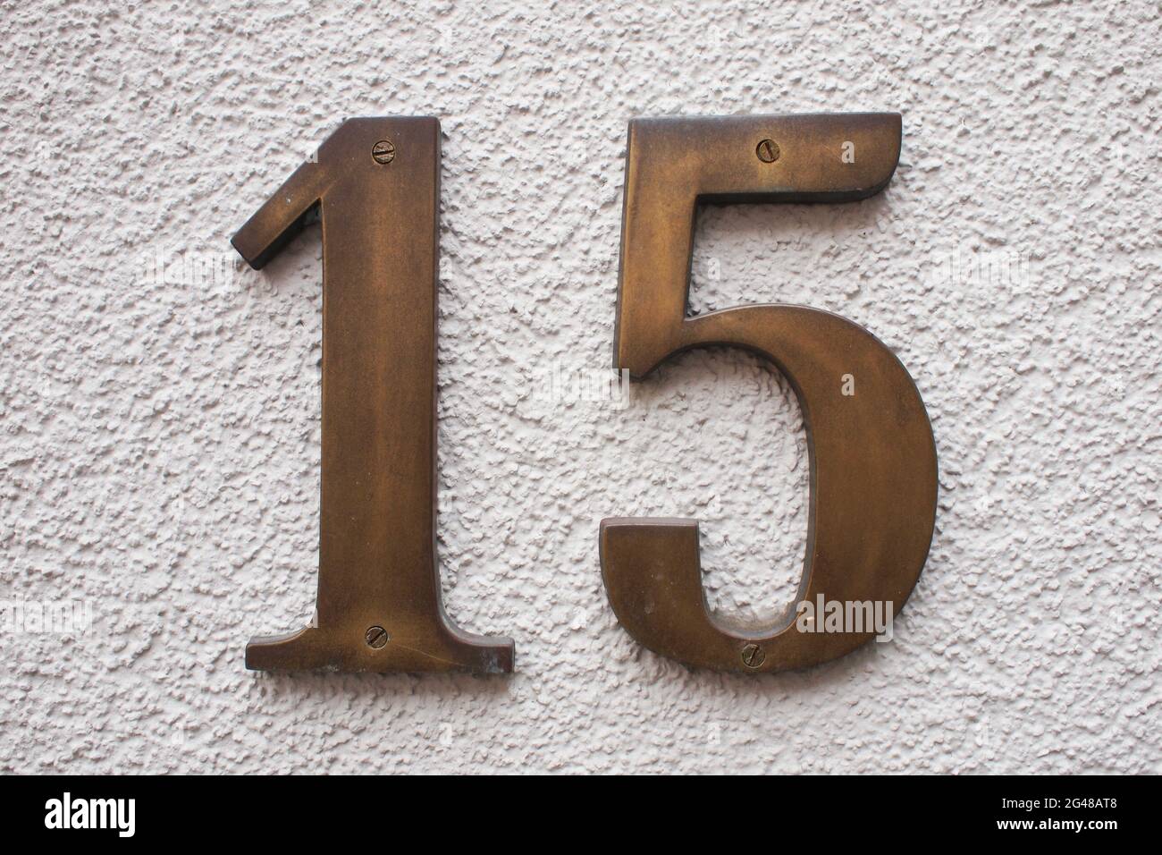 House number "15" attached to a wall Stock Photo - Alamy