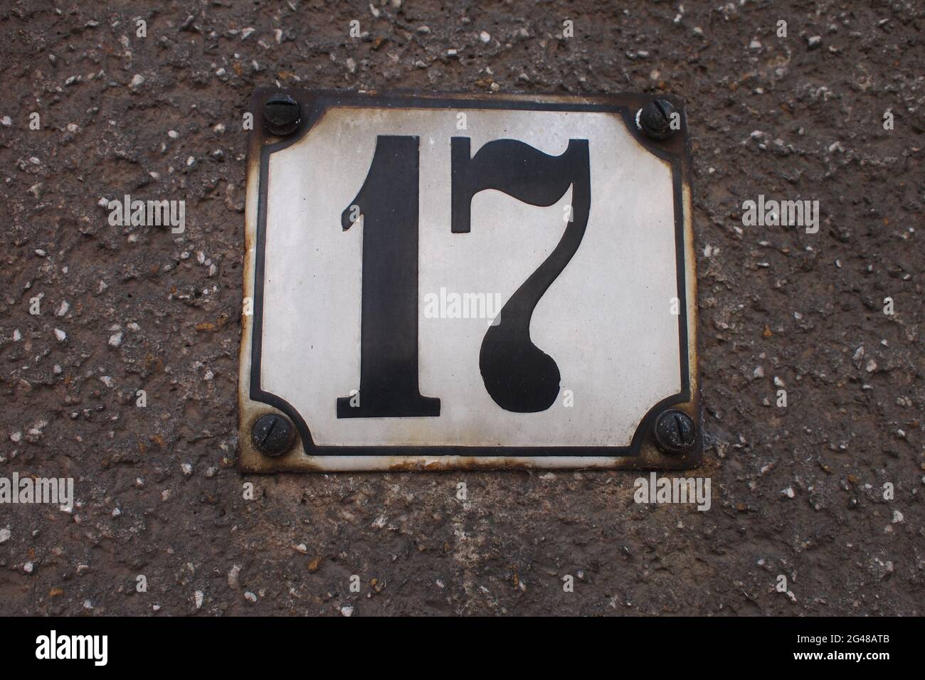 House number "17" attached to a wall Stock Photo - Alamy