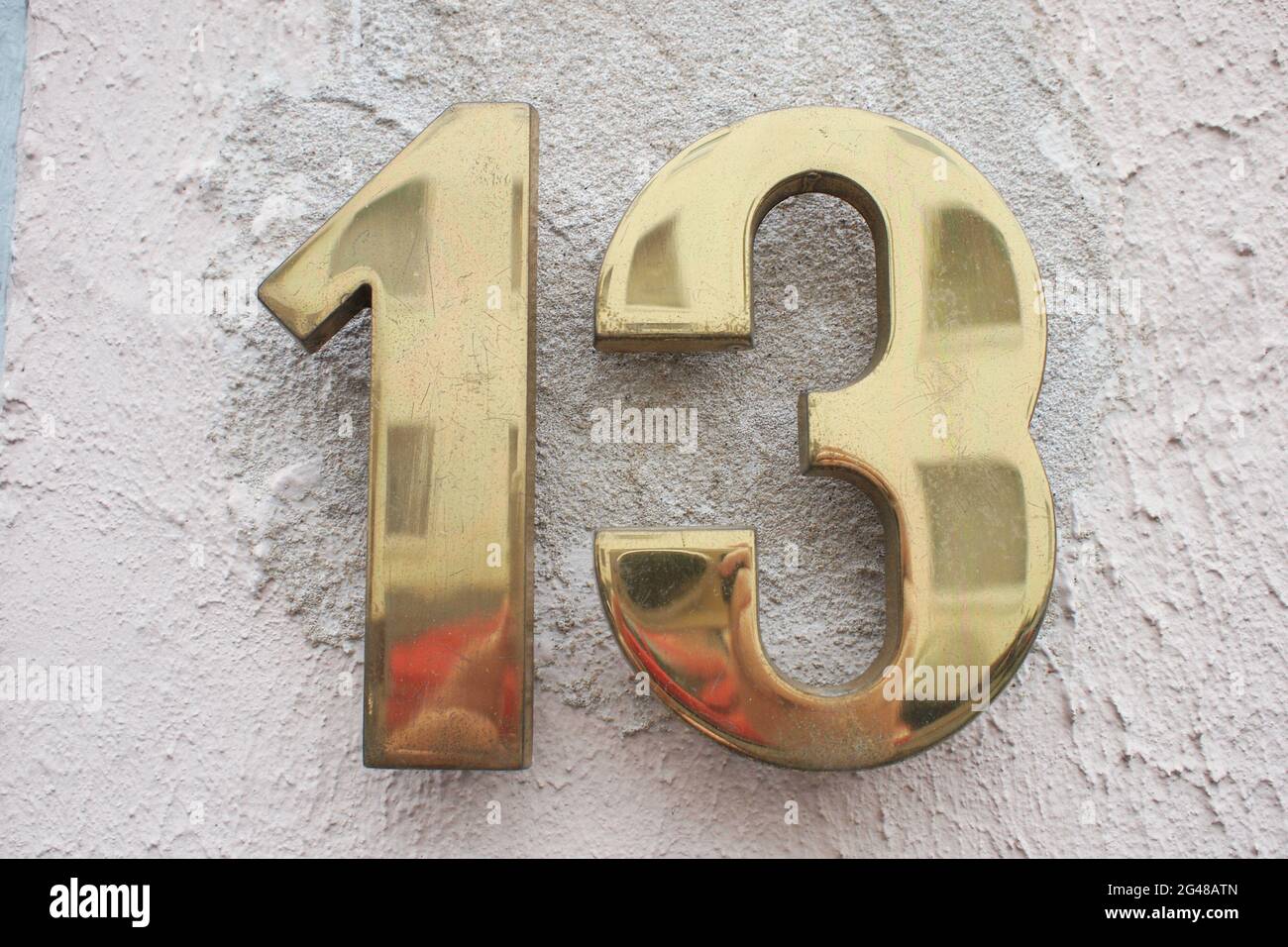 House number "13" attached to a wall Stock Photo - Alamy