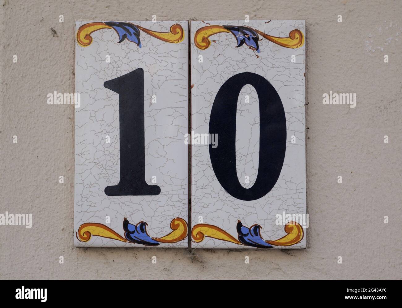 House number "10" attached to a wall Stock Photo - Alamy