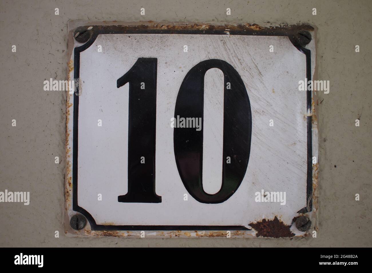 House number "10" attached to a wall Stock Photo - Alamy