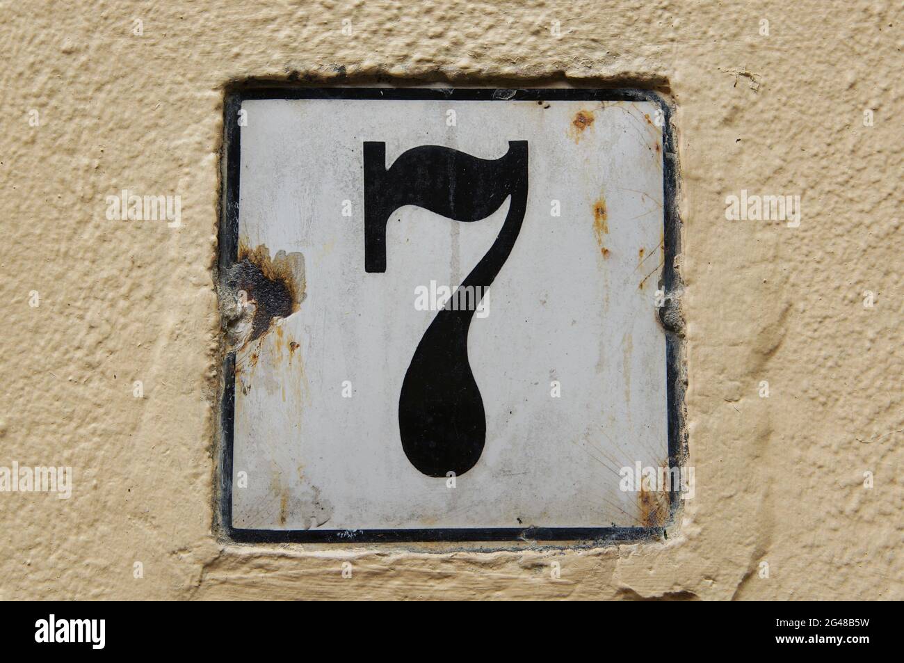 House number "7" attached to a wall Stock Photo - Alamy