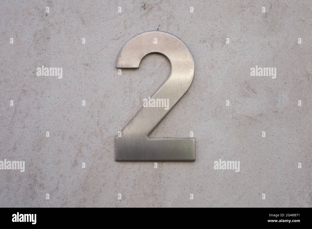 House number "2" attached to a wall Stock Photo - Alamy