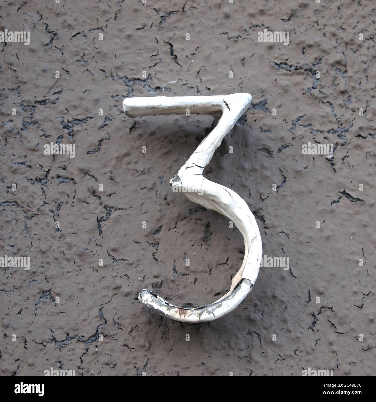 House number "3" attached to a wall Stock Photo - Alamy