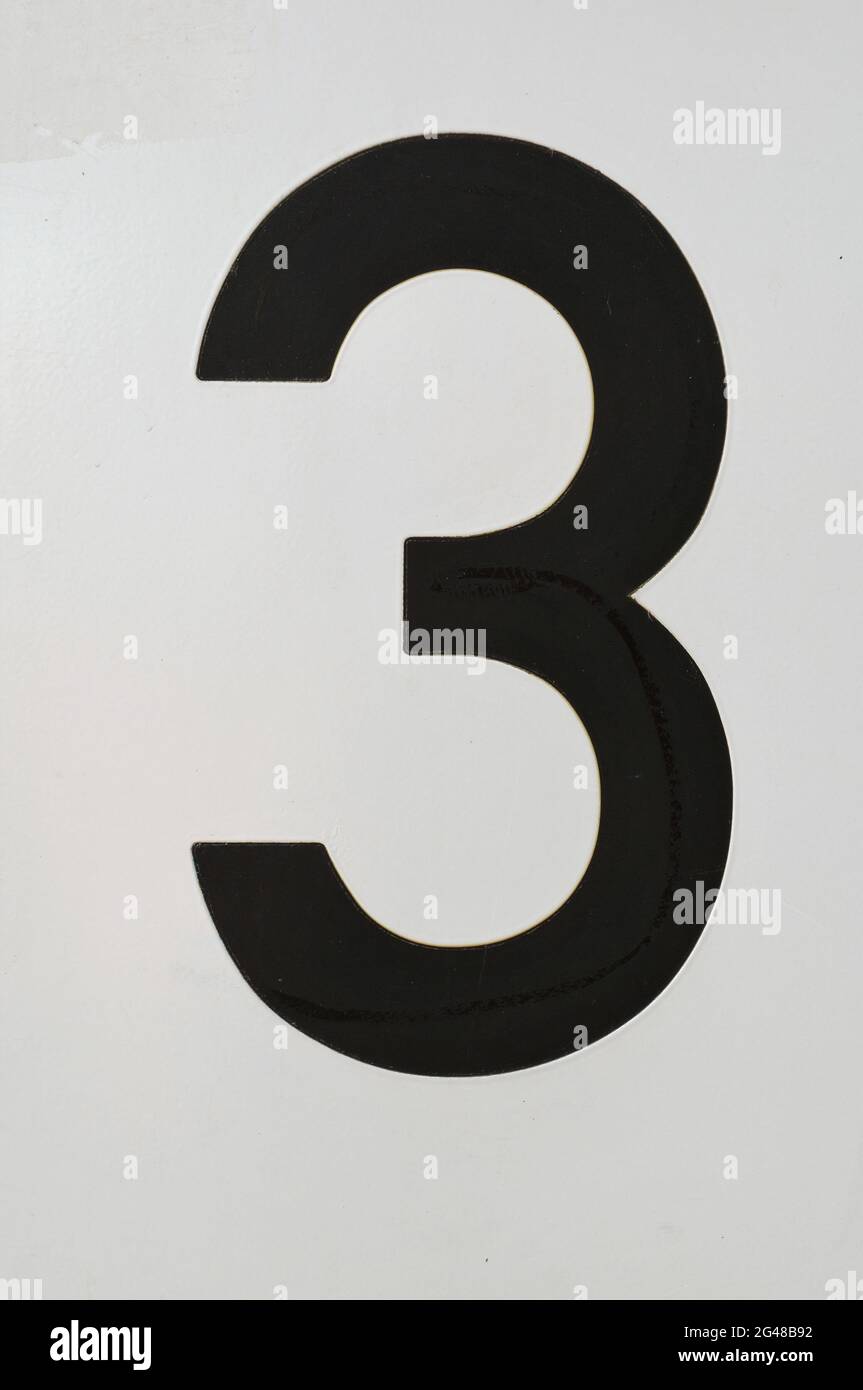 House number "3" painted on a wall Stock Photo - Alamy