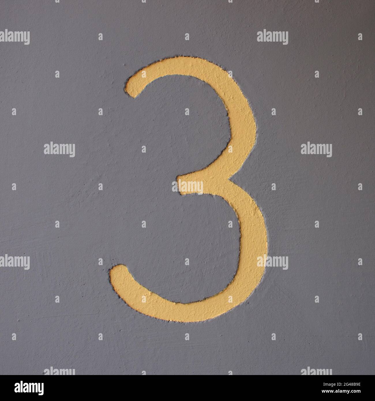 House number "3" painted on a wall Stock Photo - Alamy