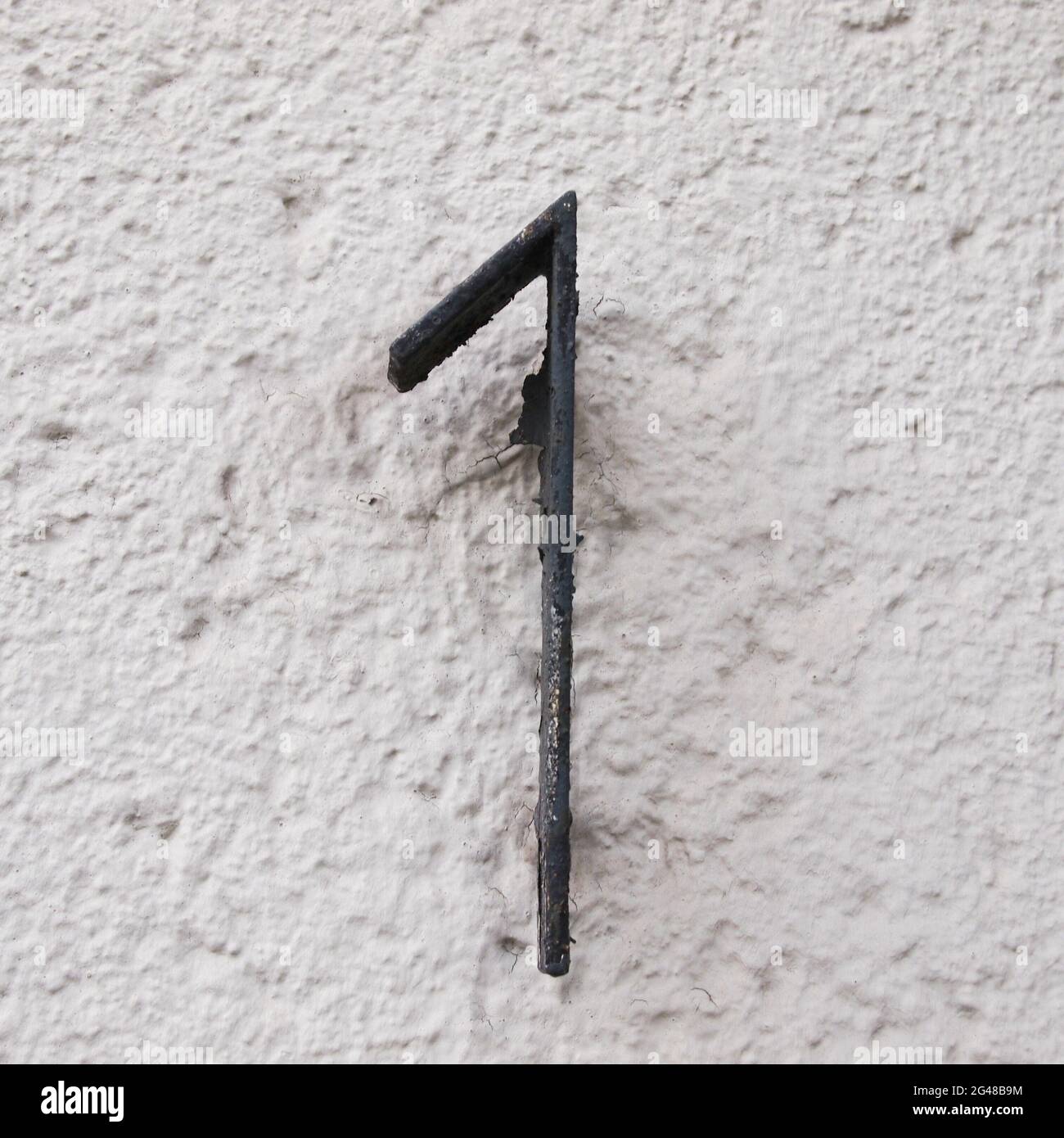House number "1" attached to a wall Stock Photo - Alamy