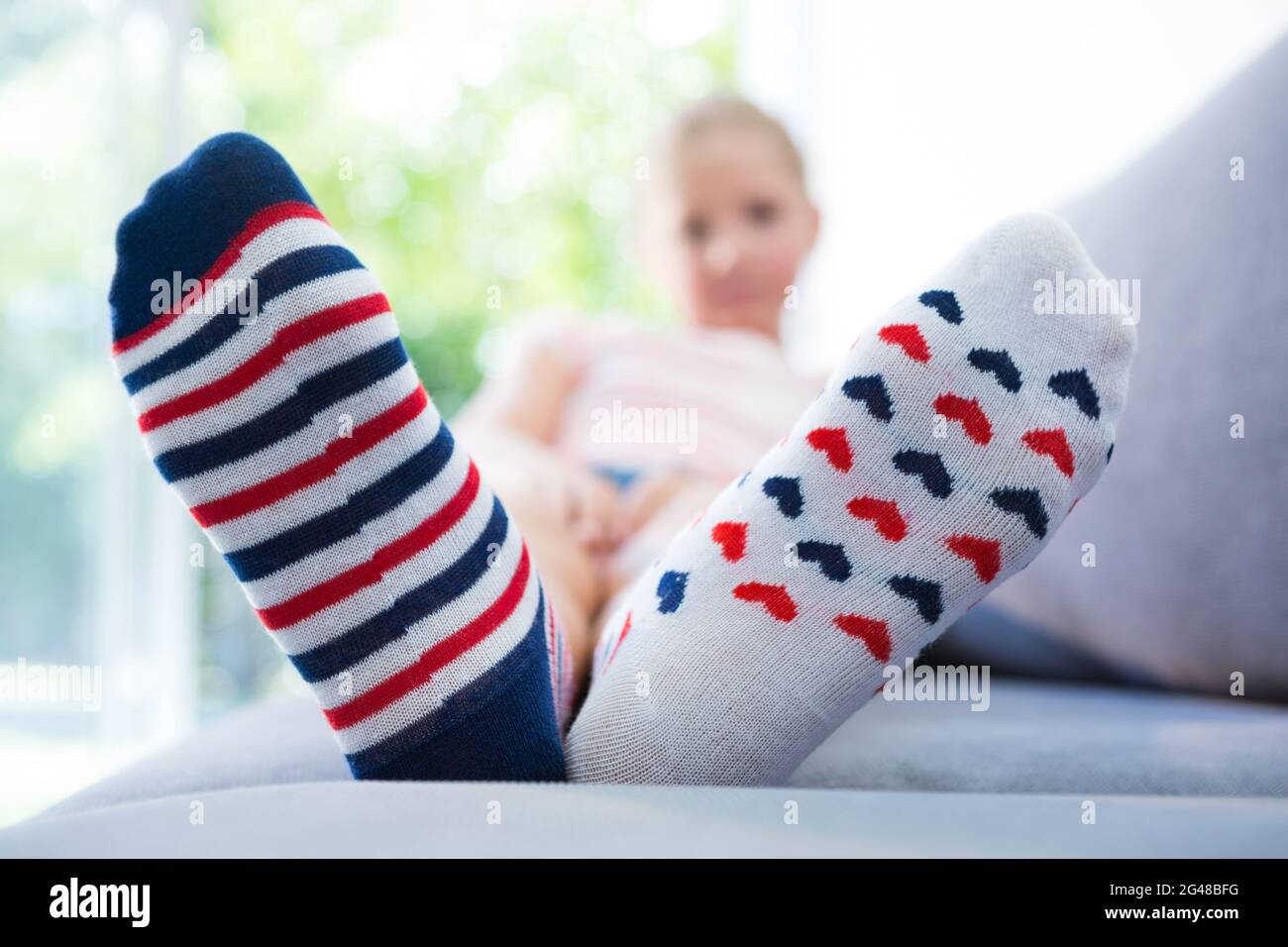 Girl wearing different socks Stock Photo - Alamy