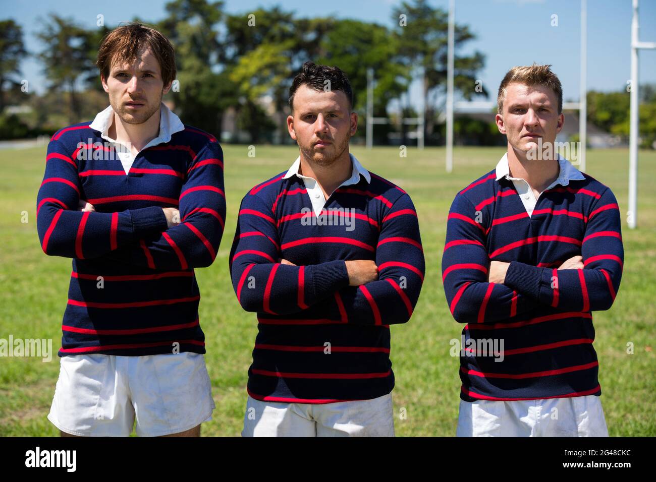 Portrait of confident rugby players standing at sports field Stock ...