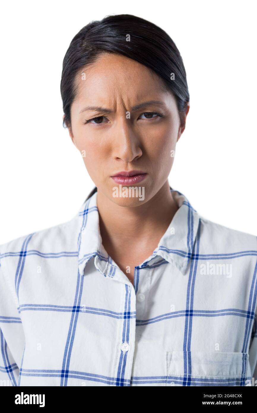 Confused woman against white background Stock Photo - Alamy