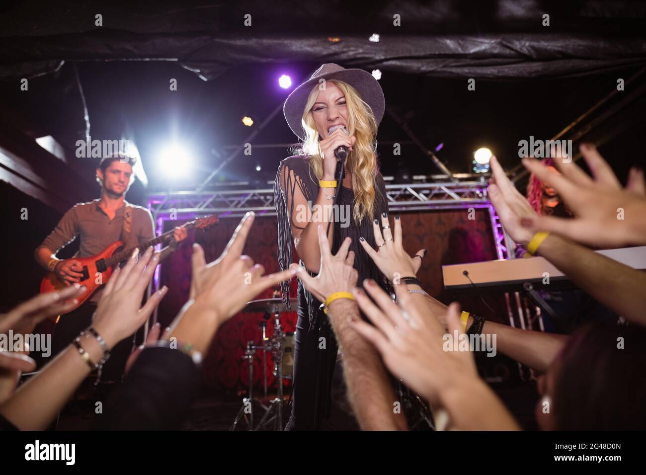 Female singer holding mic band hi-res stock photography and images - Alamy