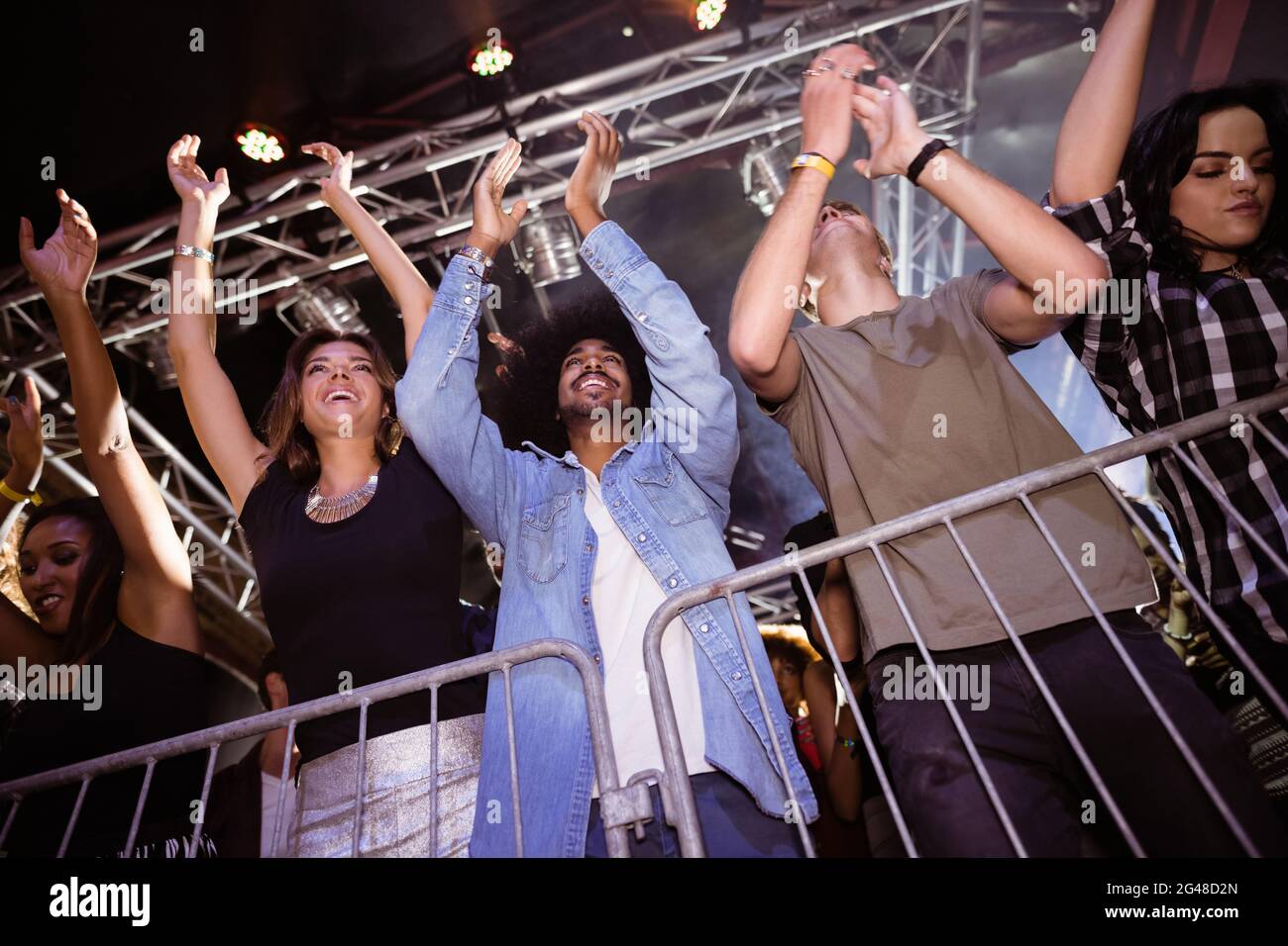 Low angle view of crowd enjoying at nightclub Stock Photo - Alamy
