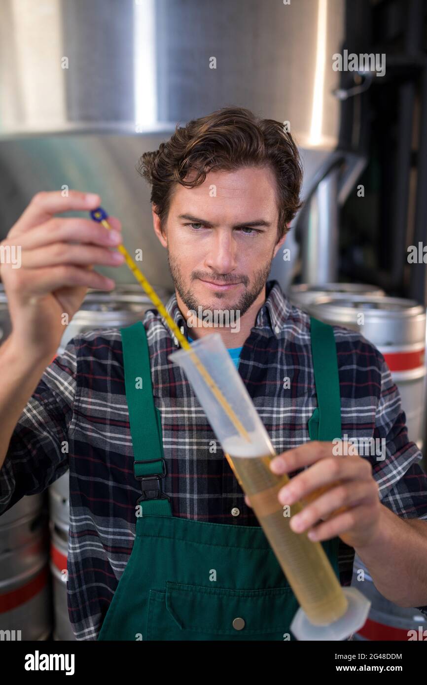 Worker testing beer Stock Photo - Alamy