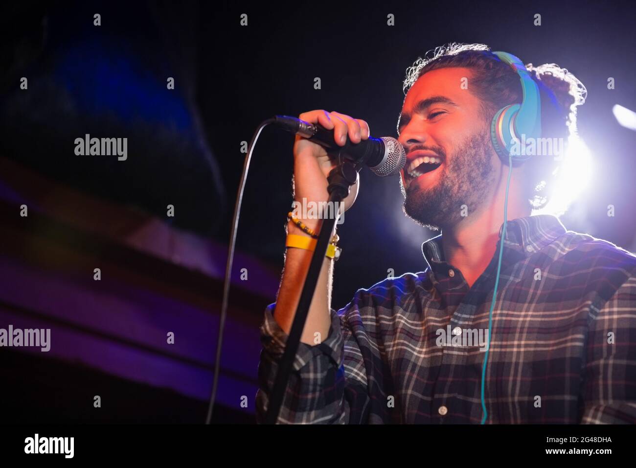 Standing holding singing microphone skill hi-res stock photography and ...