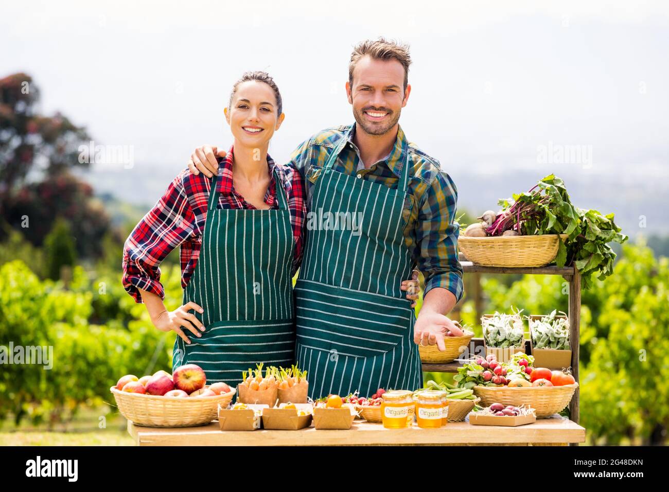 Portrait of couple selling vegetables Stock Photo - Alamy